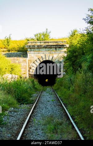 Beautiful entrance of a train tunnel, beautiful sun and nature ...