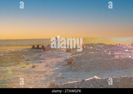 Graveyard in a green environment, with an Arabic sentence written on ...