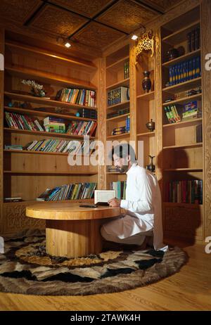Hand holding the Holy Quran, guidance of life concept Stock Photo - Alamy