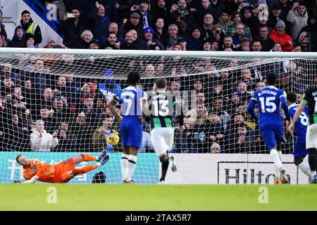 Chelsea's Enzo Fernandez (right) scores their side's first goal of the ...