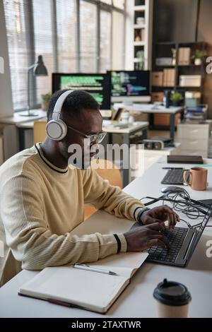 Black guy working on his laptop Stock Photo - Alamy