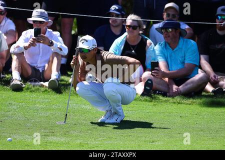 Min Woo Lee of Australia lines up a putt in round two of the Australian ...