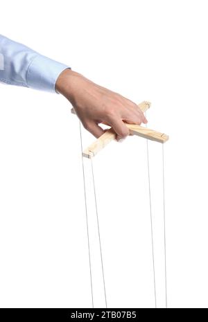 Man holding puppet control bar with strings on white background ...
