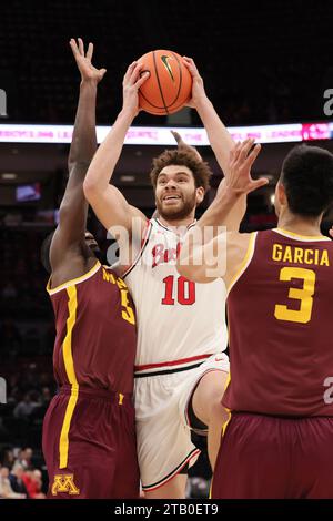 Minnesota forward Dawson Garcia (3) drives toward the hoop as Purdue ...