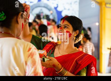 A beautiful woman playing sindur khela on the occasion of vijya dashmi ...