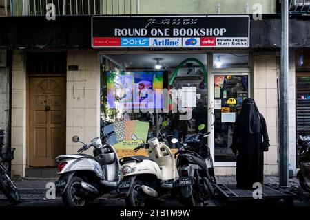 Maldives. 04th Dec, 2023. A woman wearing a burqa walks out of a ...