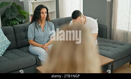 Young hispanic man psychologist having therapy session using touchpad ...