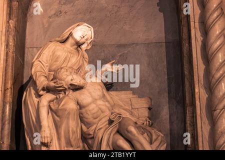 statues of Christ next to the Virgin Mary holding Jesus after the crucifixion in an ancient ...