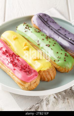 Delicious eclairs with custard on yellow background Stock Photo - Alamy