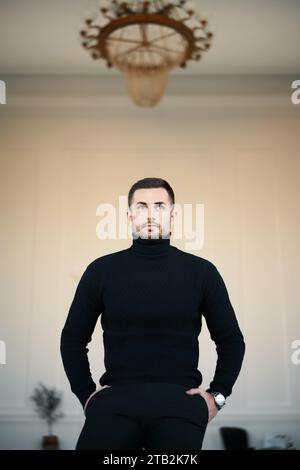 charismatic man in a classic suit and steampunk goggles on a black ...