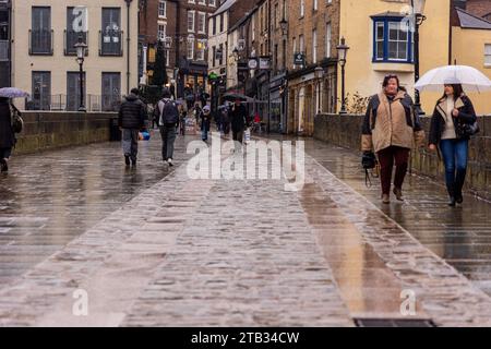 Durham, UK, 04 Dec 2023, UK Weather: Person with an umbrella passes the ...