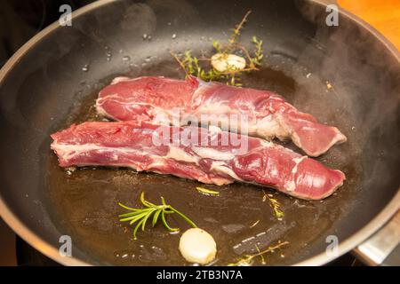 Pan-searing wild boar loin (young wild boar loin Stock Photo - Alamy