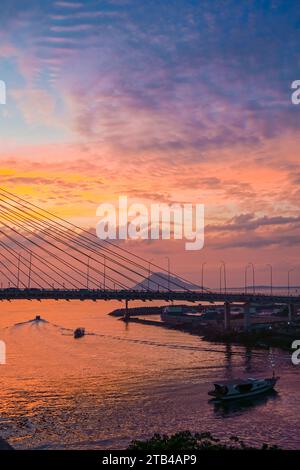 Manado port and Soekarno Bridge at sunset in the provincial capital of ...