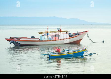 Indonesia Bunaken - View outrigger boat to Saladin Island beach Stock ...