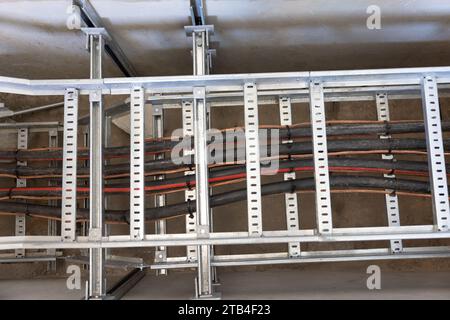electric cable duct on a metal frame underground in a trench, cable ...