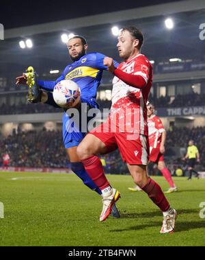 AFC Wimbledon's Ryan Johnson (right) scores an own goal to give Luton ...