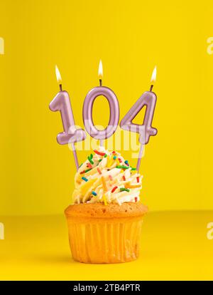 Candle number 104 - Birthday in blues foamy background Stock Photo - Alamy