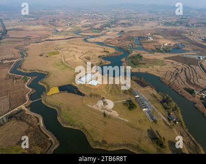 (231205) -- JINGMEN, Dec. 5, 2023 (Xinhua) -- An archeologist works at ...