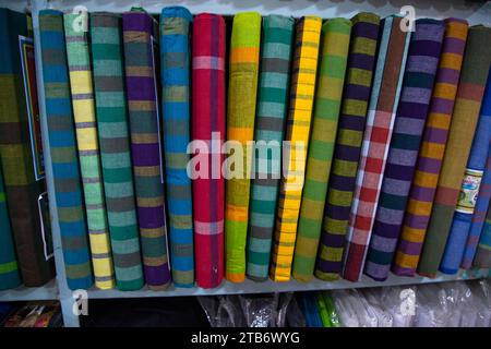 Multicolor Traditional Bangladeshi men's wear lungi folded on a rack in ...