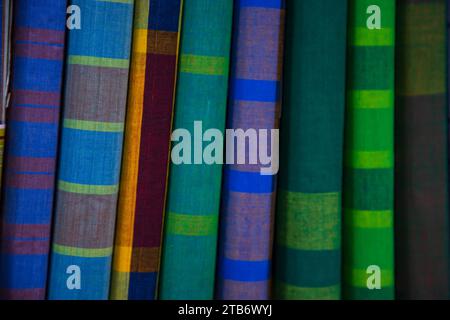 Multicolor Traditional Bangladeshi men's wear lungi folded on a rack in ...