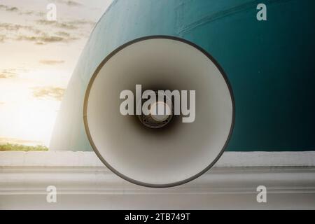Closeup view of megaphone hanging outside the building Stock Photo - Alamy