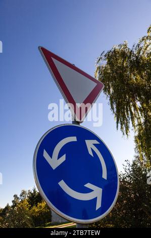 Give way sign at a roundabout. Circular motion. Traffic signs Stock ...