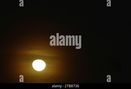 bright yellow full moon floating on sky in night Stock Photo - Alamy