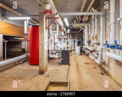 Boiler room in the basement of a new building, a public housing blocks ...