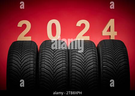 Car tires, winter wheels, isolated new tyres, fog and happy new year ...
