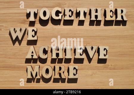 TEAM Acronym for Together wE Achieve More, motivational words in wooden ...