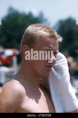 DETROIT, MI - AUGUST, 1956: American diver Jerry Harrison goes into his ...