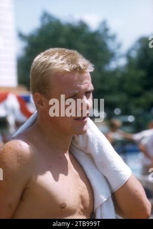 DETROIT, MI - AUGUST, 1956: American diver Jerry Harrison goes into his ...