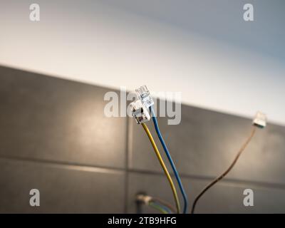 Wago connector on the electrical wires in a hollow wall socket box ...