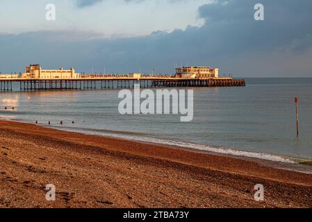 Worthing Pier and beach with seadefences of rocks and a groyne ...
