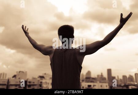 strong motivated inspired man facing the city Stock Photo - Alamy