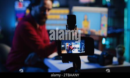 Photo editor content creator filming video on selecting editorial ...