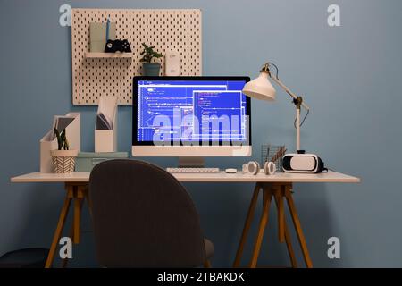 Interior of office with programmer's workplace and pegboard Stock Photo ...