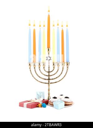 Menorah, dreidels and delicious food for Hanukkah celebration on light ...