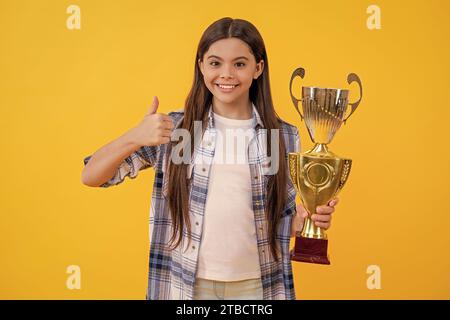 smiling teen girl receive award in studio. teen girl accept award on ...