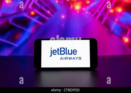 In this photo illustration, a jetBlue airways logo is seen displayed on ...