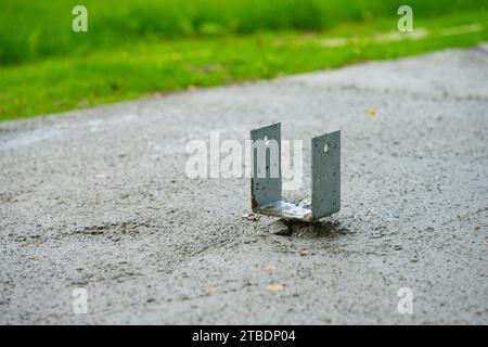 Metal beam fixing set in concrete Stock Photo - Alamy