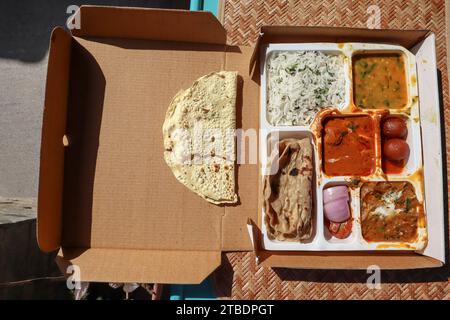North Indian thali top view. roti, pappad rice and variety of curries ...