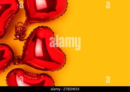 Frame made of red inflatable foil balloons in a heart shape. Concept on ...