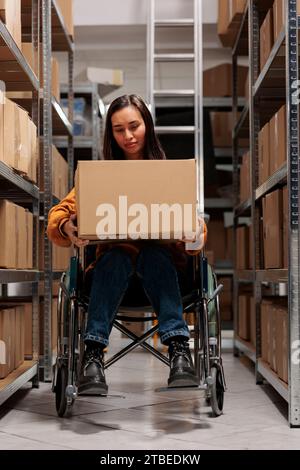 Postal service worker with disability holding package while working in ...