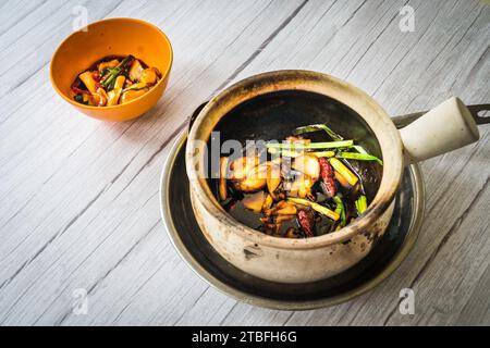 Stir fry frog leg with spring onions and dried reed chilli and served ...