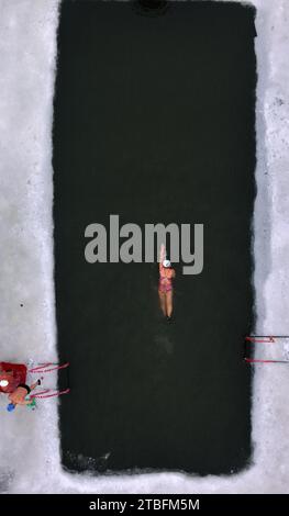Winter swimming enthusiasts dive into the icy water in Shenyang City ...