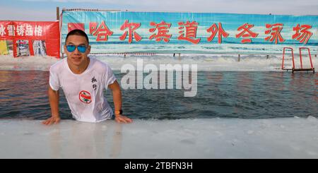 Winter swimming enthusiasts dive into the icy water in Shenyang City ...