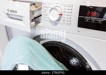 Wash clothes in a Bosch washing machine Stock Photo - Alamy