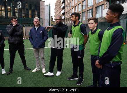Coach Dominic McGeekie, sports minister Stuart Andrew, and former ...