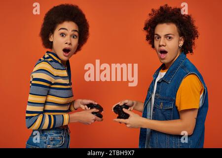 good looking african american brother and sister playing video games ...